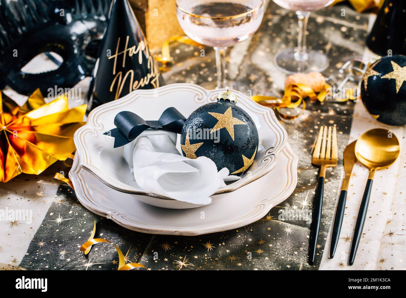 New year table setting with decoration for dining and party in black ...