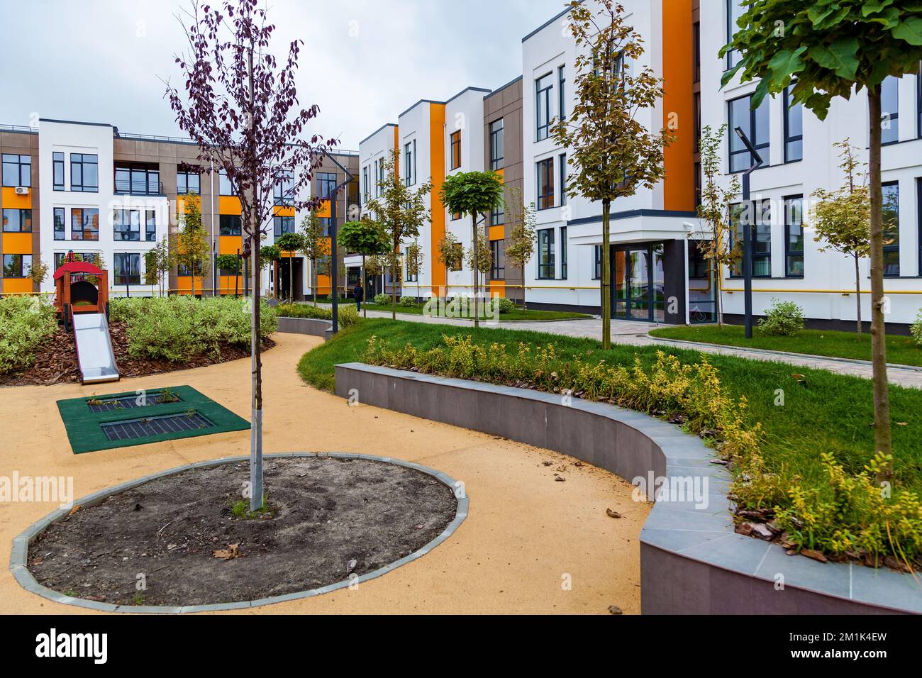 Green recreation area with various shrubs and trees, a children's ...