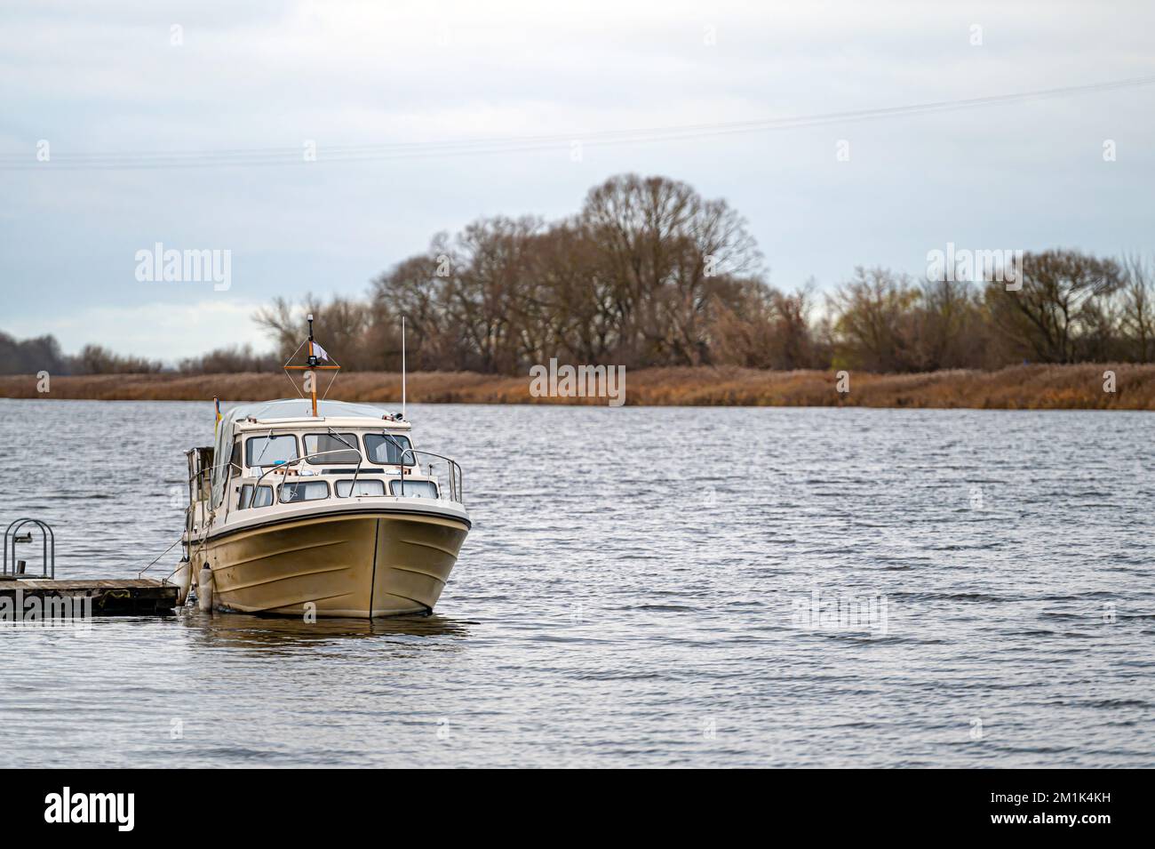 Motorboat docked on lake shore hi-res stock photography and images - Alamy