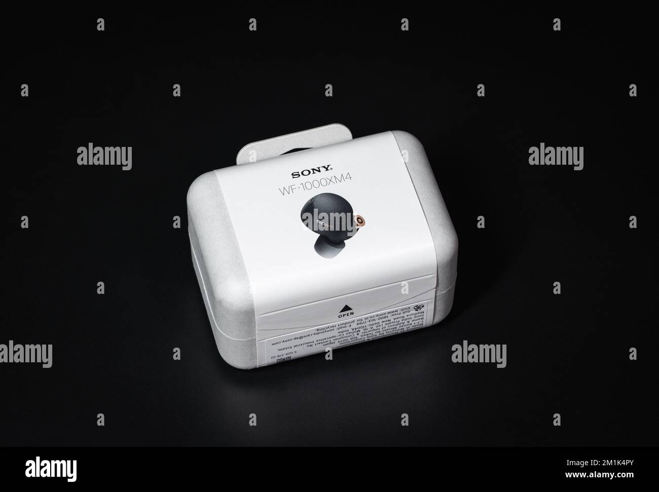 A sealed box of the Sony WF-1000XM4 truly wireless headphones on black ...