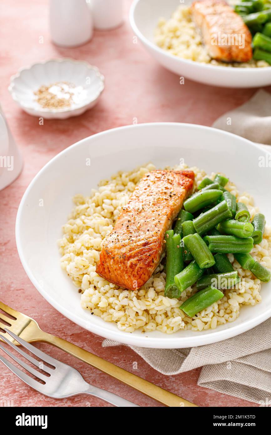 Salmon fillet grilled with bulgur and green beans. Healthy food, diet ...