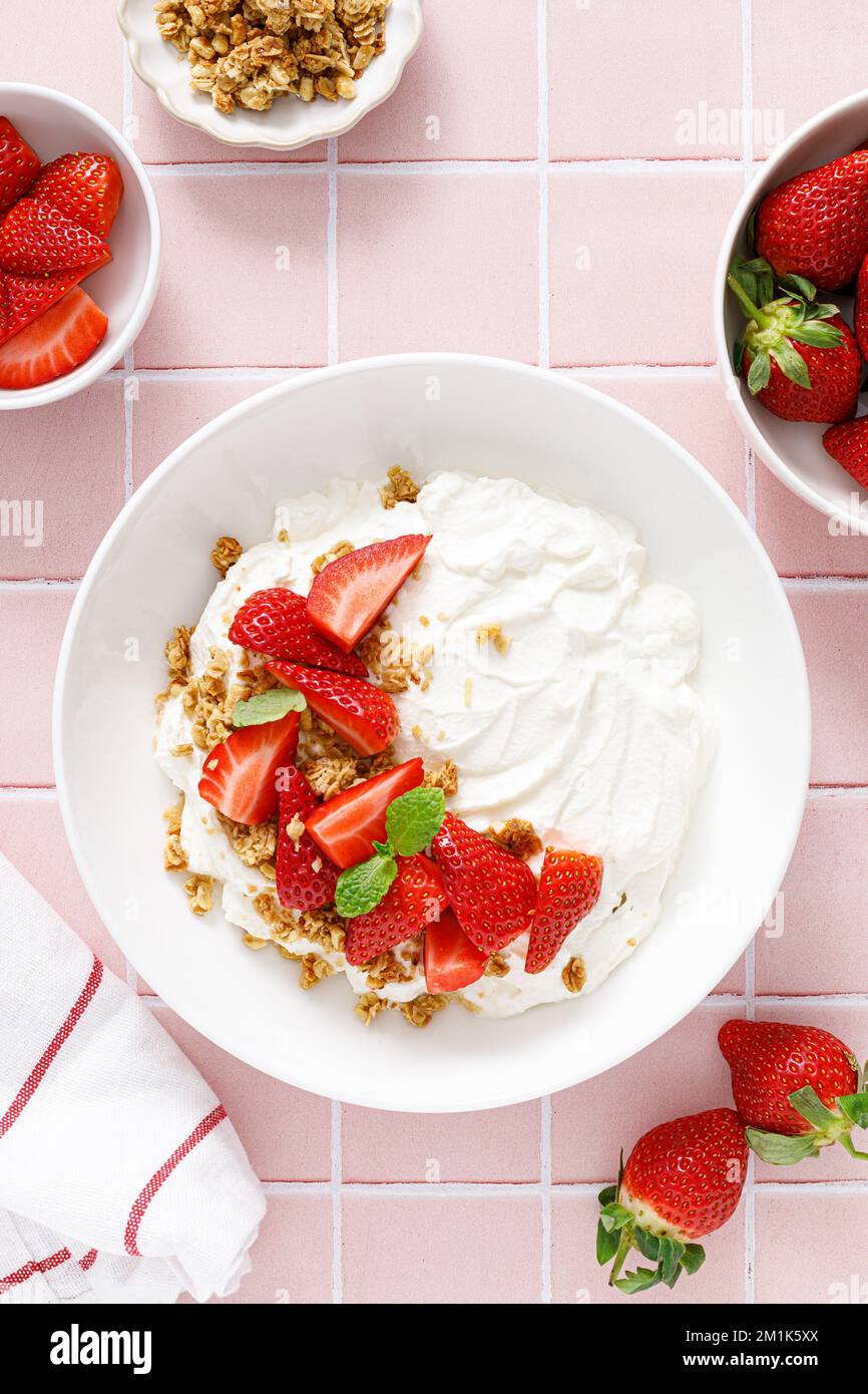 Yogurt with strawberry. Plain white greek yogurt with fresh berries and ...