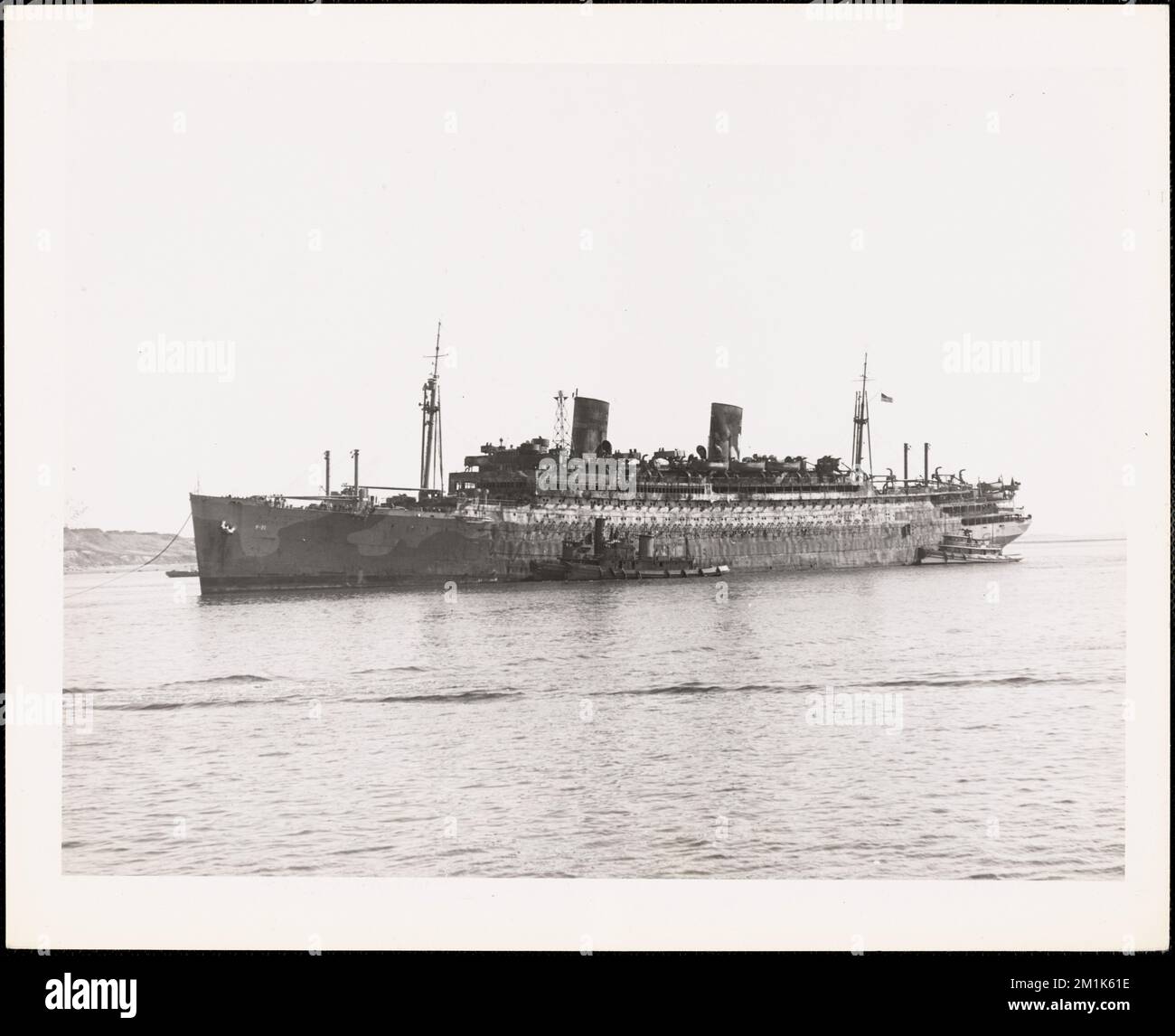 AP-21 USS WAKEFIELD Being towed to US Naval Drydock after fire at sea ...