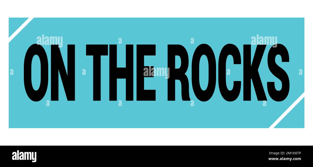 ON THE ROCKS text written on blue-black grungy stamp sign Stock Photo ...