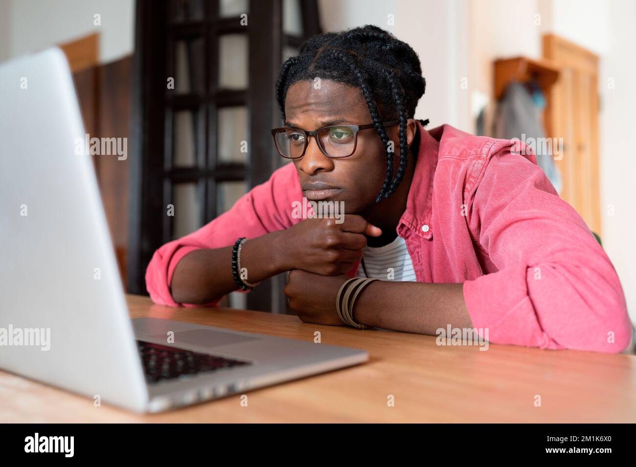 Upset depressed African guy freelancer experiencing apathy and ...
