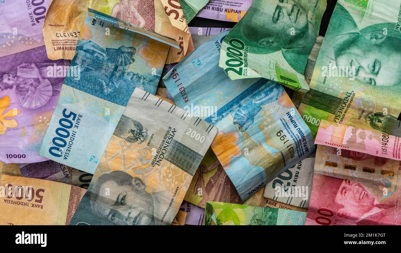pile of rupiah banknotes as background Stock Photo - Alamy