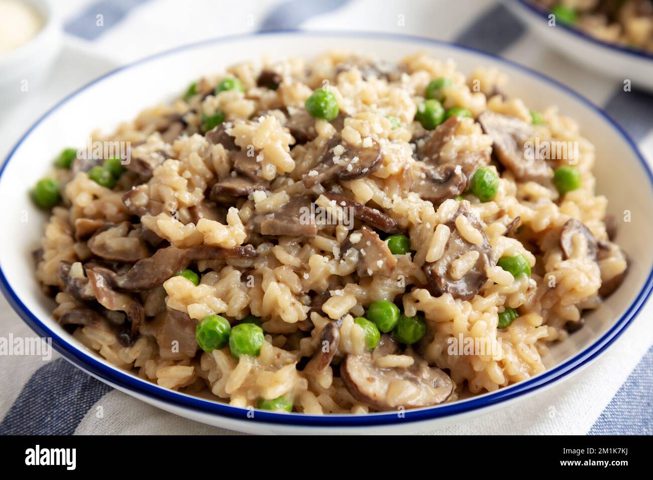 Homemade Mushroom Risotto with Peas on a Plate, side view Stock Photo ...