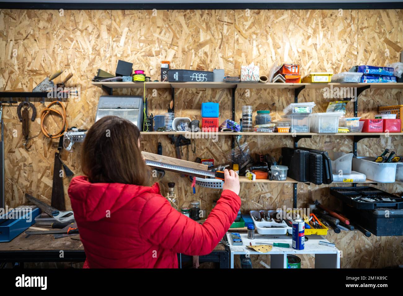 female builder in her home workshop in america making Stock Photo - Alamy