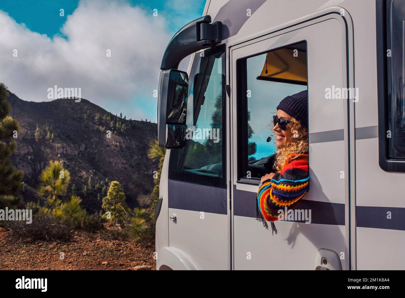 One female driver smile and enjoy travel destination outside the window ...
