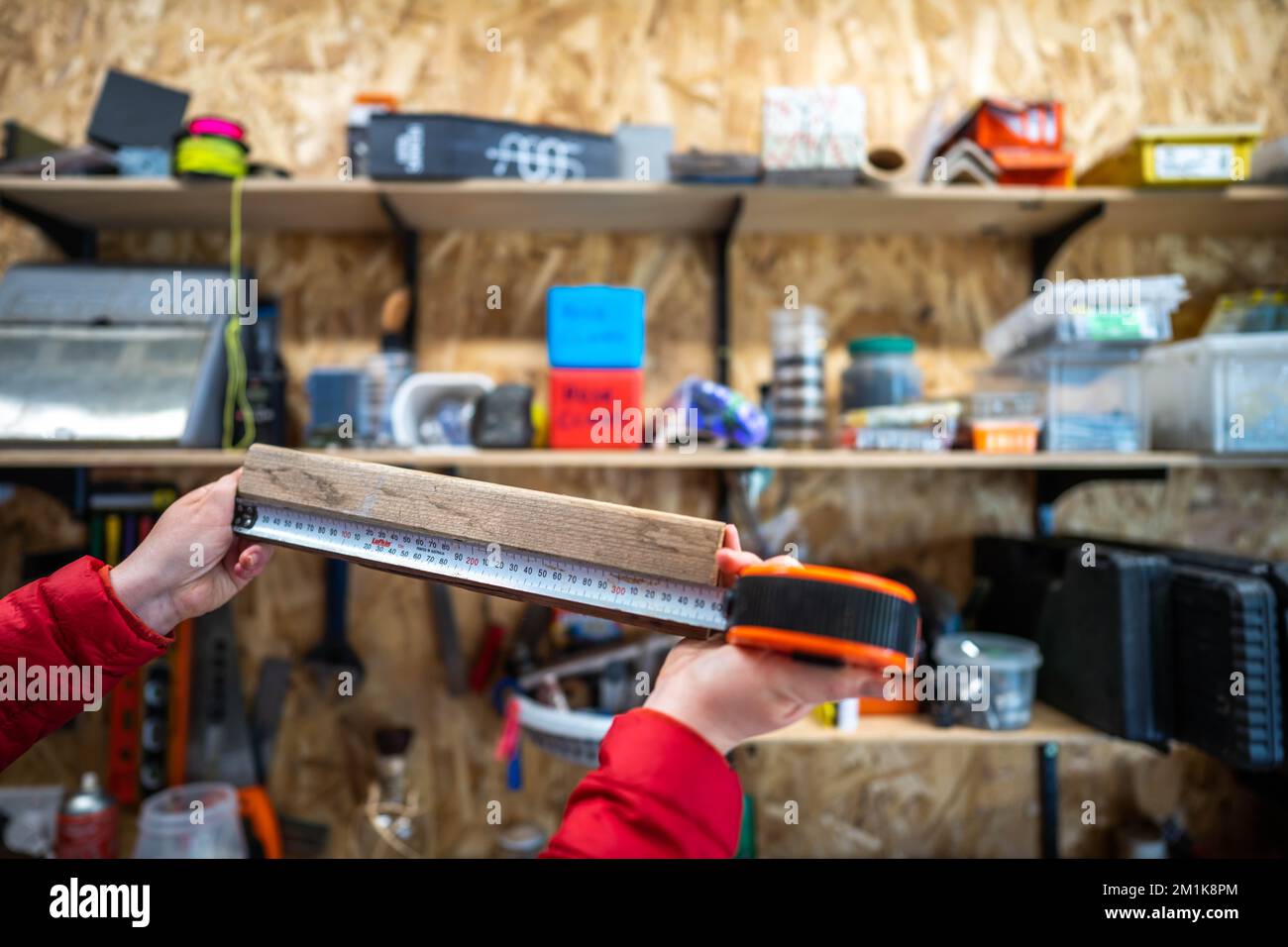 female working in a tool workshop. measuring timber in australia Stock ...