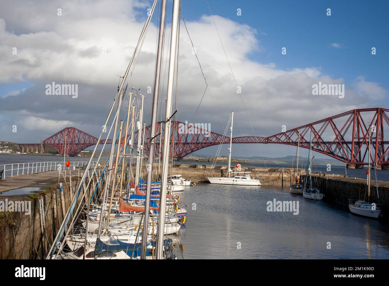 Boats in the Harbour at South Queensferry with the Forth rail bridge in ...