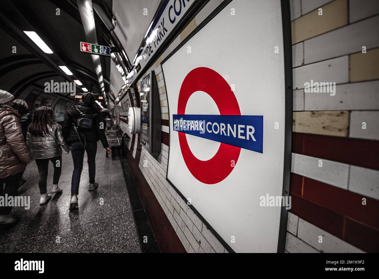 A back view of people at London Underground station, Hyde Park Corner ...