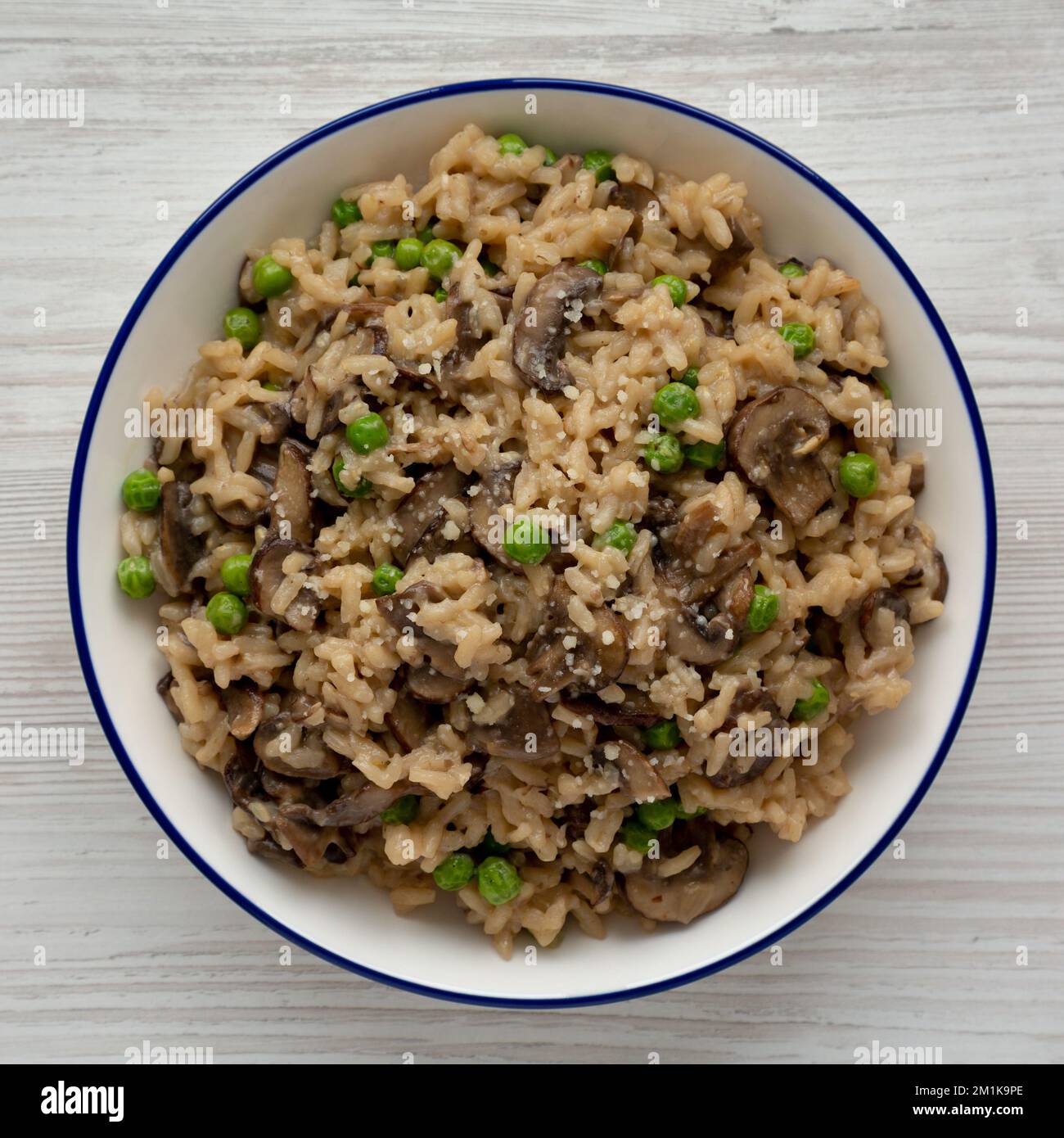 Homemade Mushroom Risotto with Peas on a Plate, top view. Flat lay ...