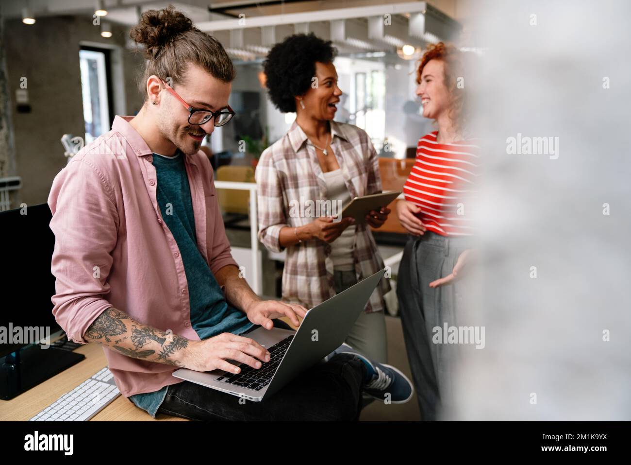 Team of young creative marketing experts brainstorming during work ...
