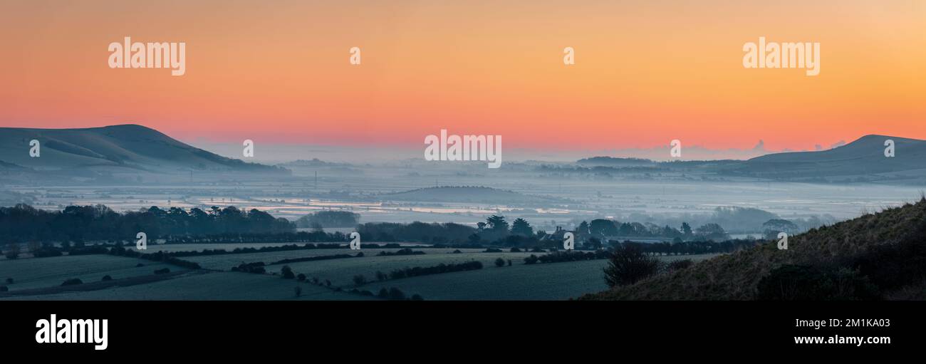 Misty morning December sunrise over mount Caburn from Kingston Ridge on ...