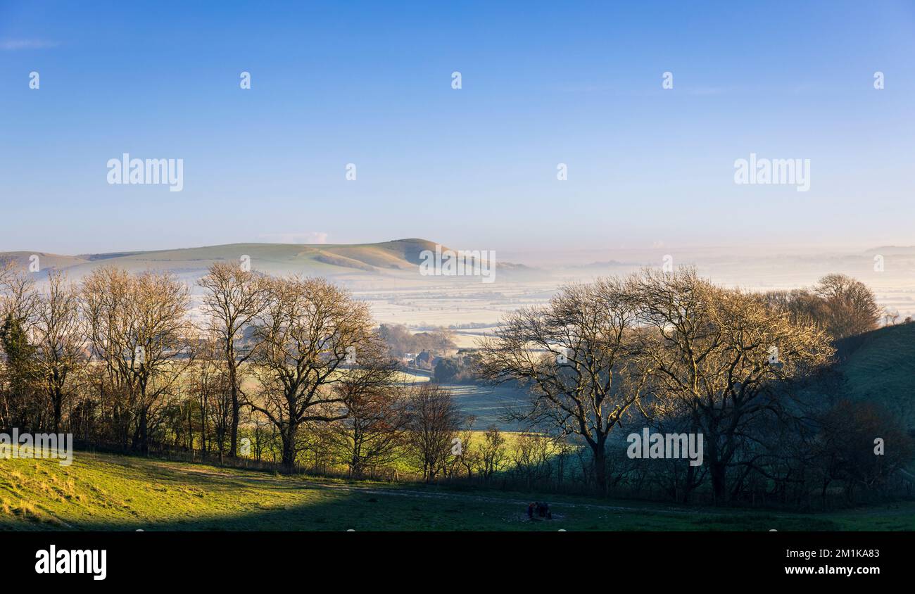 Mount Caburn rising from mist in the Ouse valley from Kingston Ridge ...