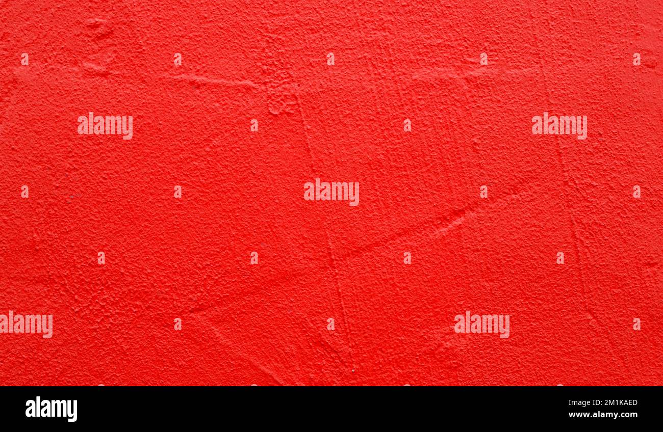Part of wall with rough red paint on surface, as texture or background Stock Photo - Alamy