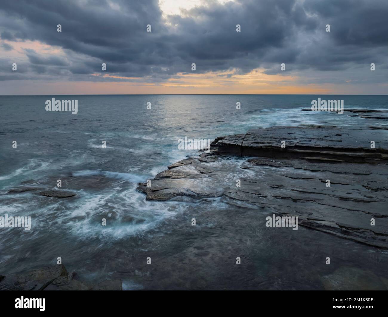 Aerial sunrise seascape with clouds at The Skillion in Terrigal, NSW ...