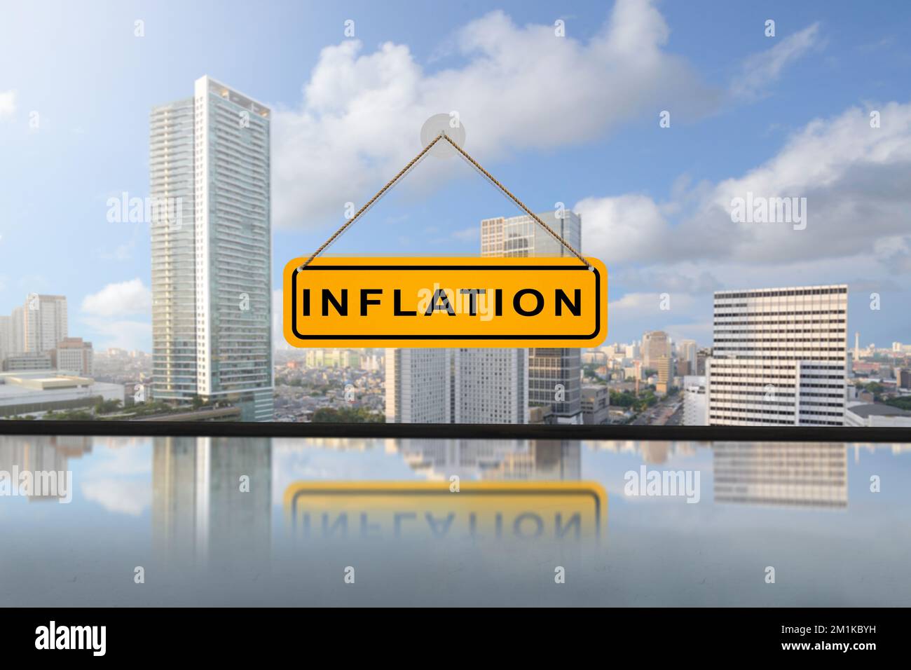 Inflation sign with cityscape background Stock Photo - Alamy