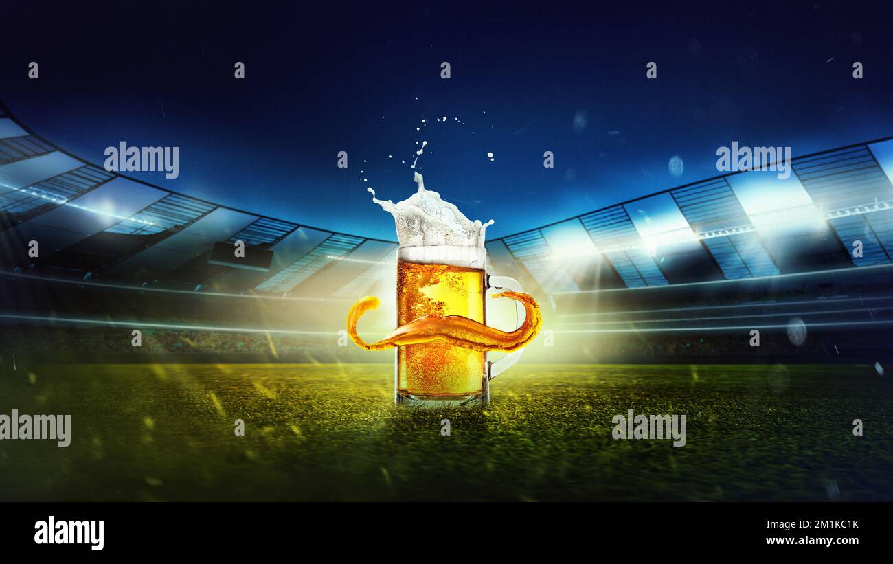 Mug of chill lager beer with foamy splashes on grass at football ...