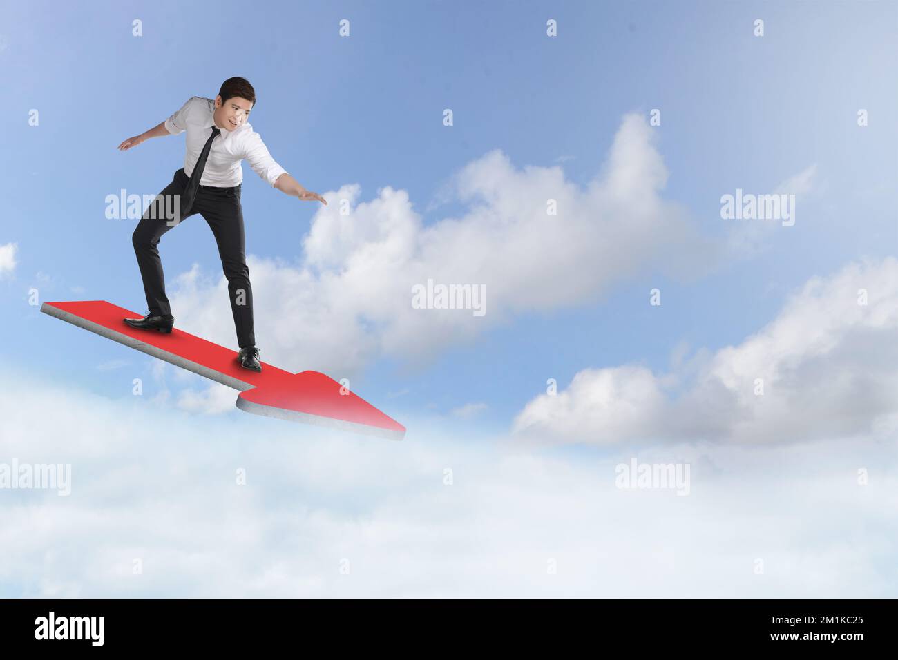 Asian businessman standing on an inflation sign with a sky background ...