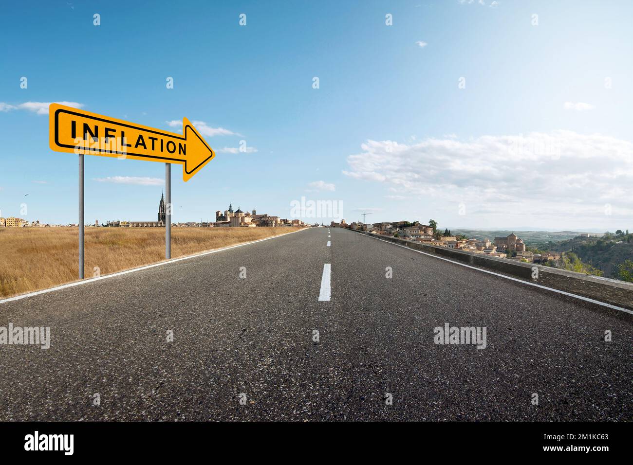 Road arrow to inflation with blue sky background Stock Photo - Alamy