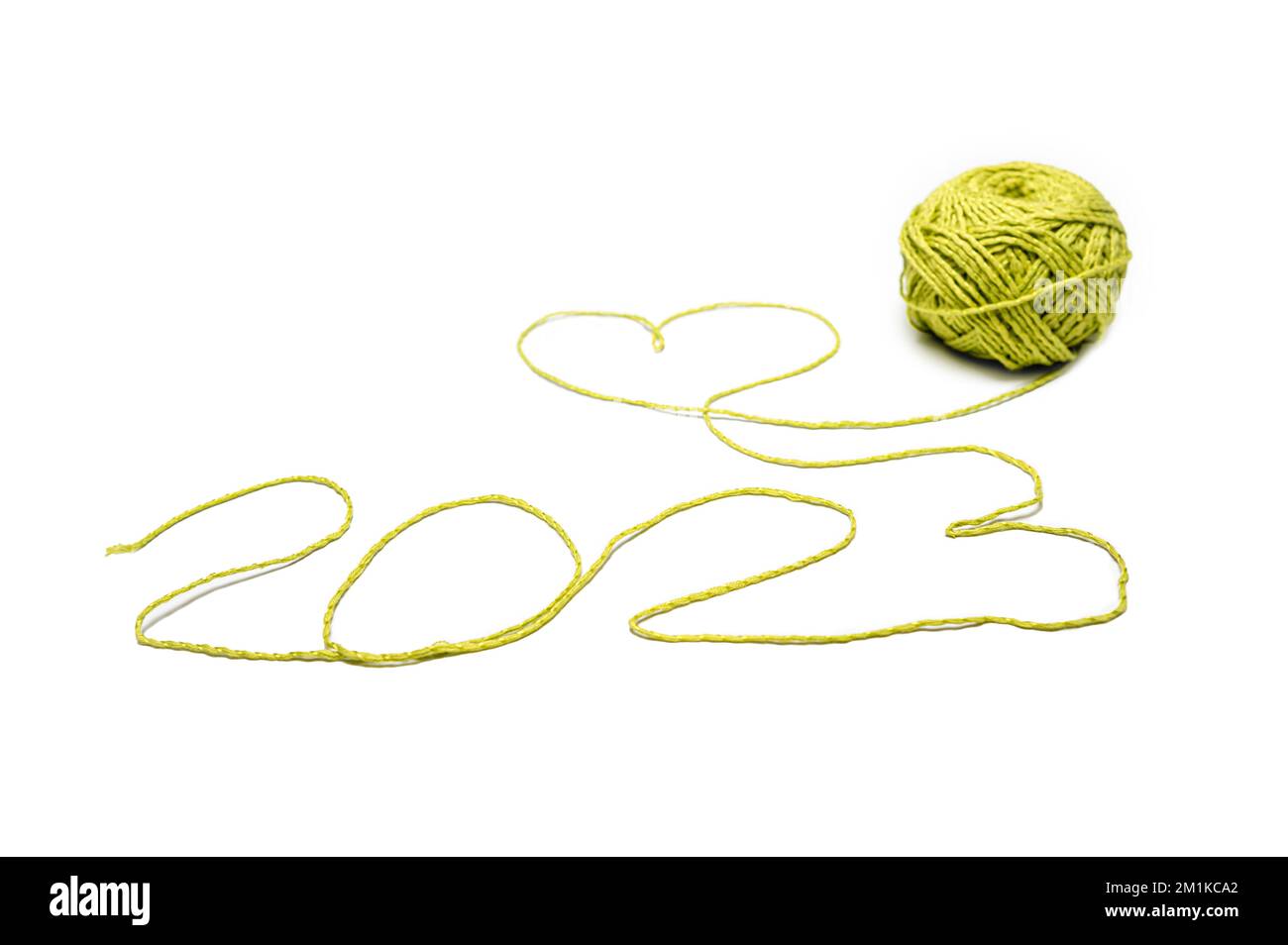 heart and number 2023 made of green yarn and ball of yarn isolated on ...
