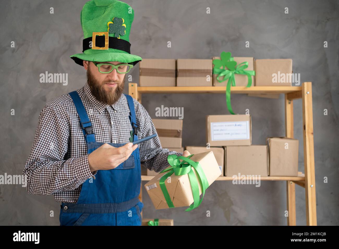 start up. businessman scanning a delivery box with his mobile phone ...