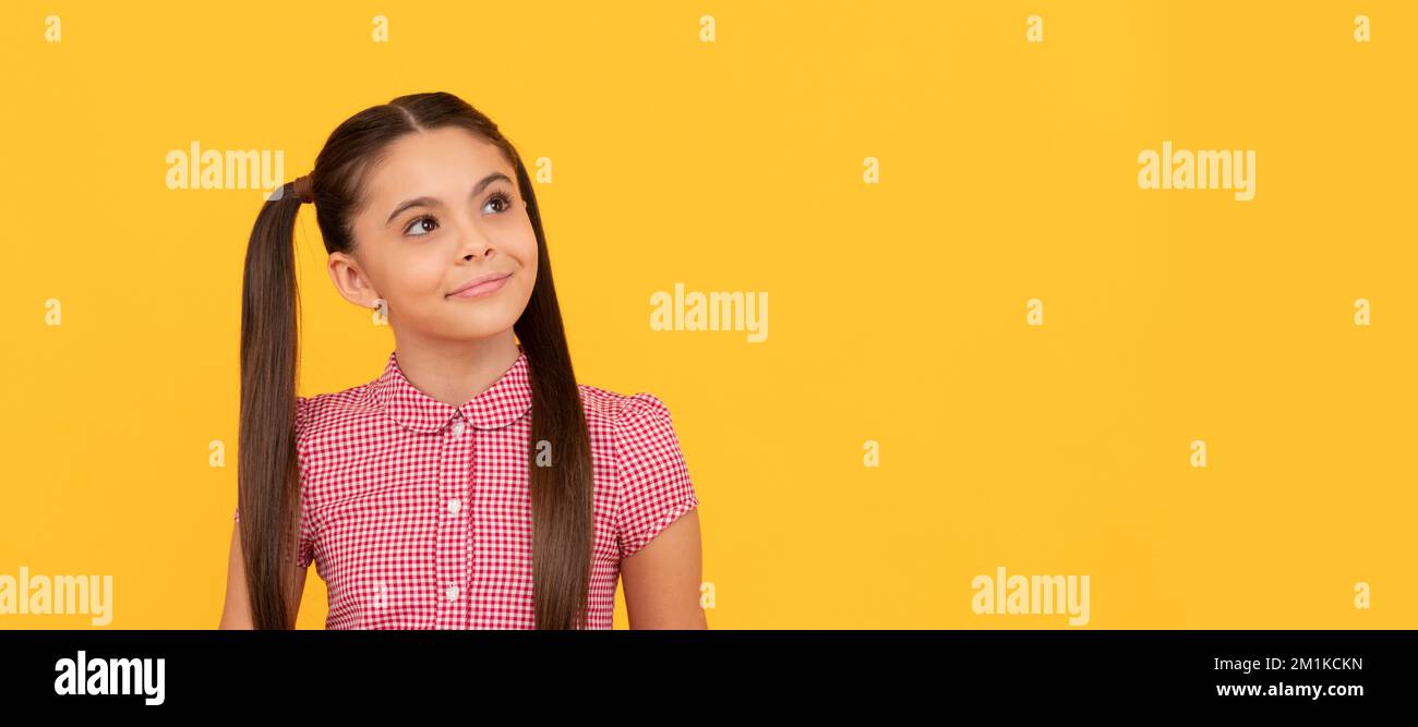 Dreamful school age girl child with pensive look fantasize about ...