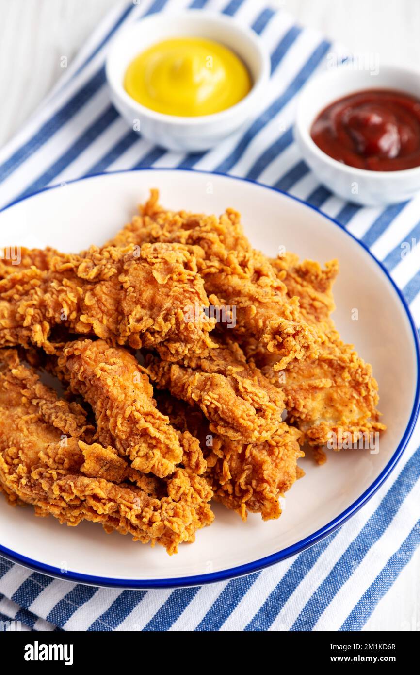 Homemade Chicken Strips with Mustard and BBQ on a Plate, side view ...