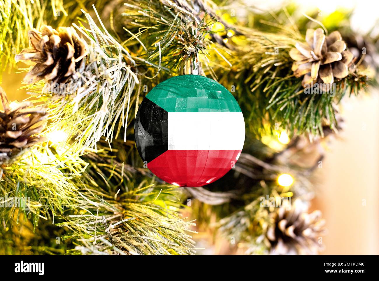 New Year's glass ball with the flag of Kuwait against a colorful ...