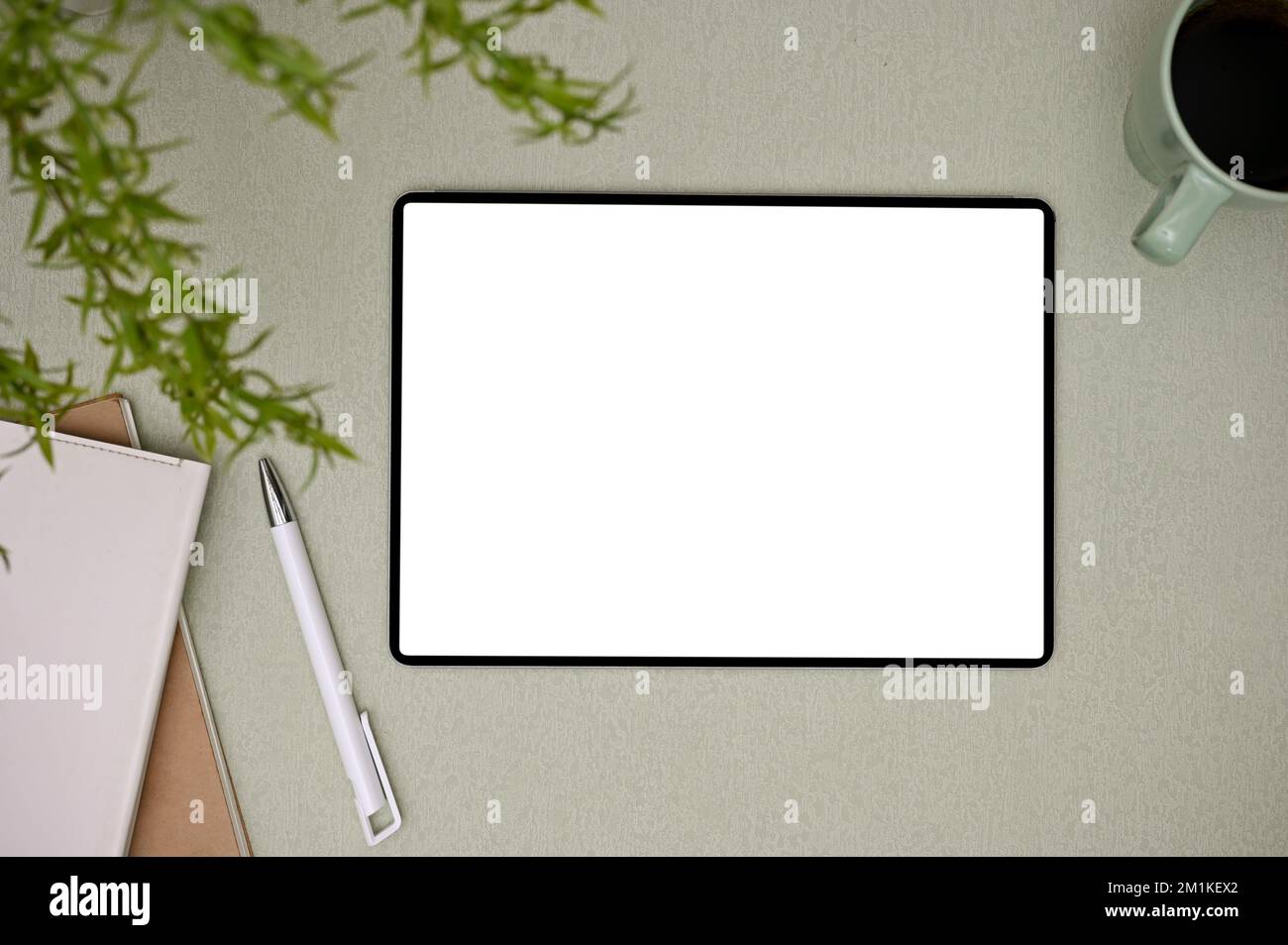 Minimal workspace with tablet white screen mockup, pen, coffee cup ...