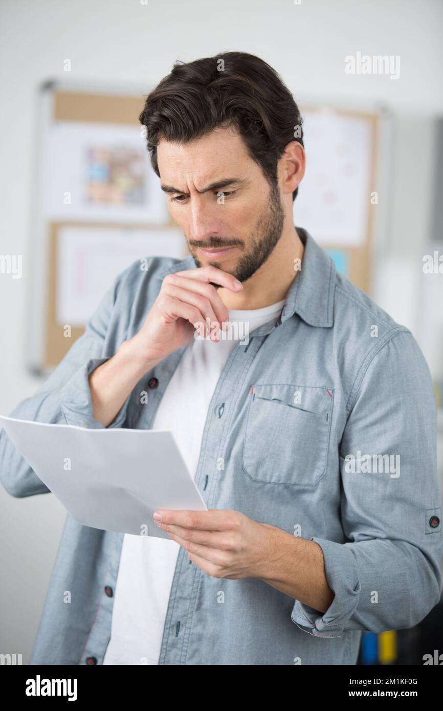 a man with instruction manual Stock Photo - Alamy