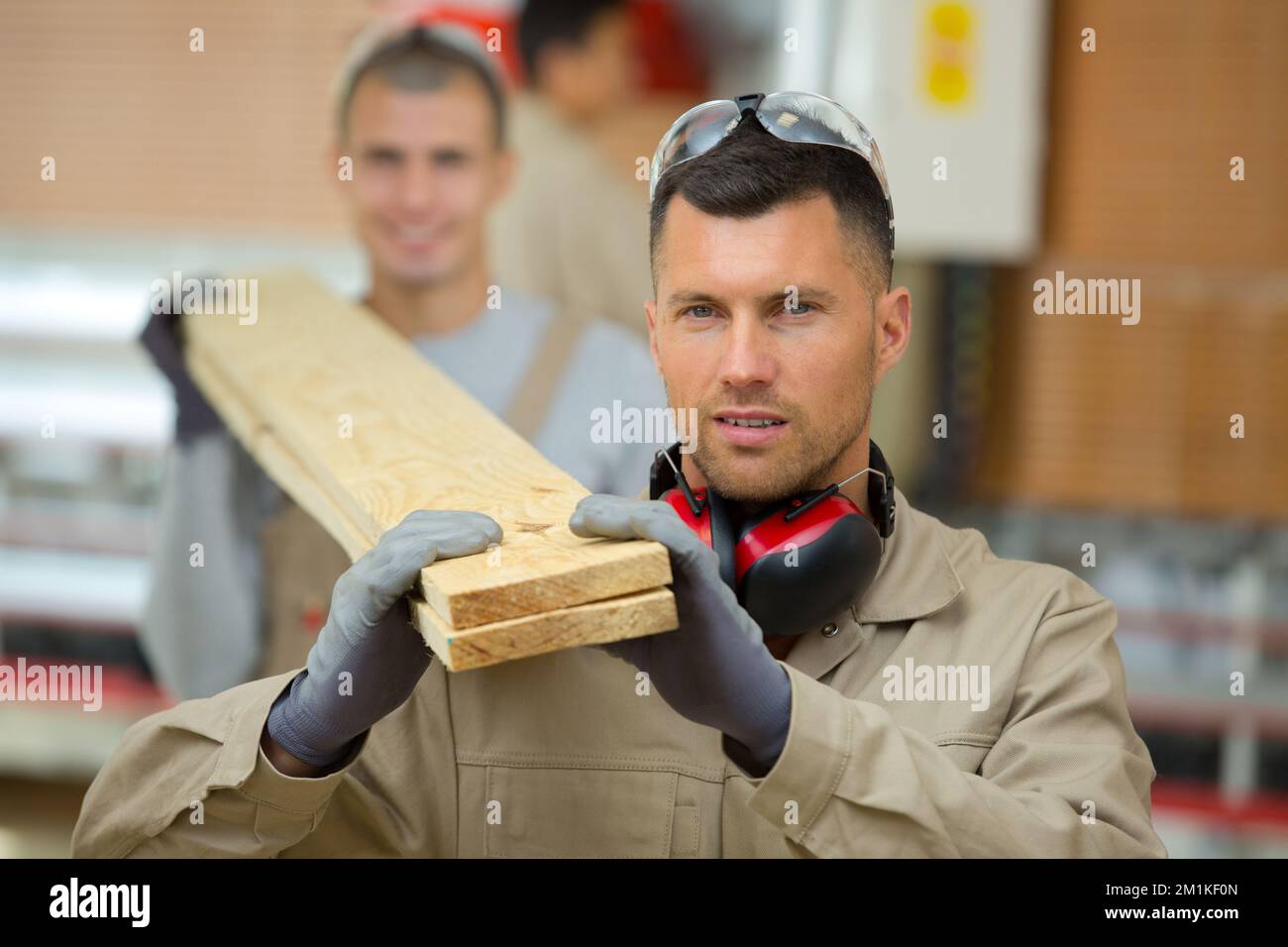 Two men carrying industry hi-res stock photography and images - Alamy