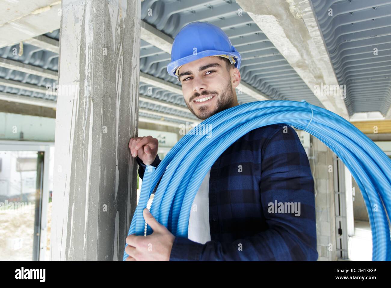 Builder holding pipes hi-res stock photography and images - Alamy