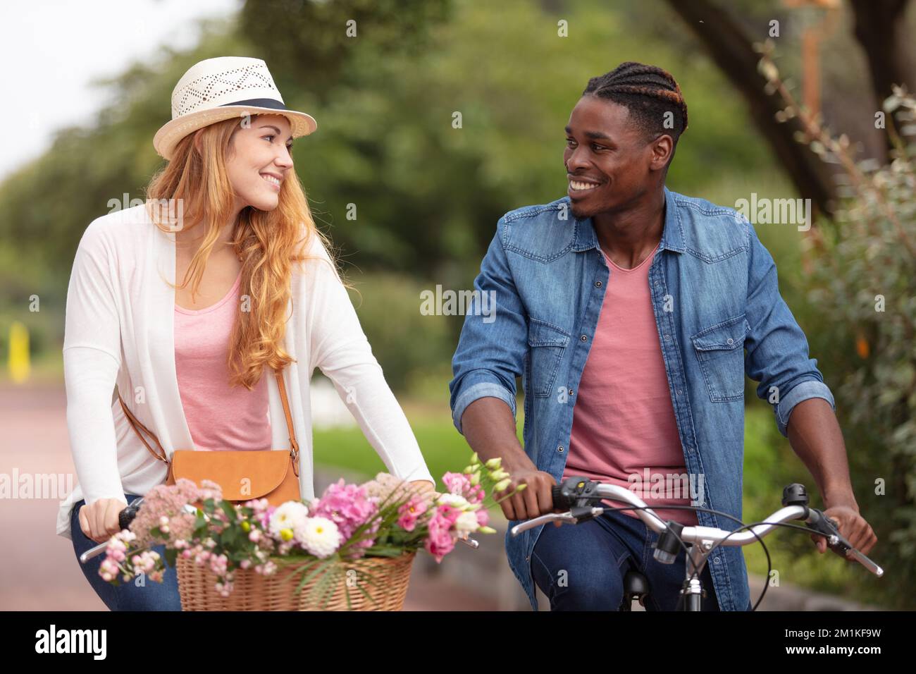 Side view romantic couple riding hi-res stock photography and images ...