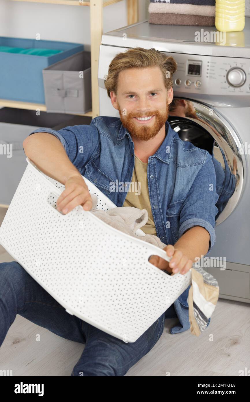 young man cleaner posing at camera Stock Photo - Alamy
