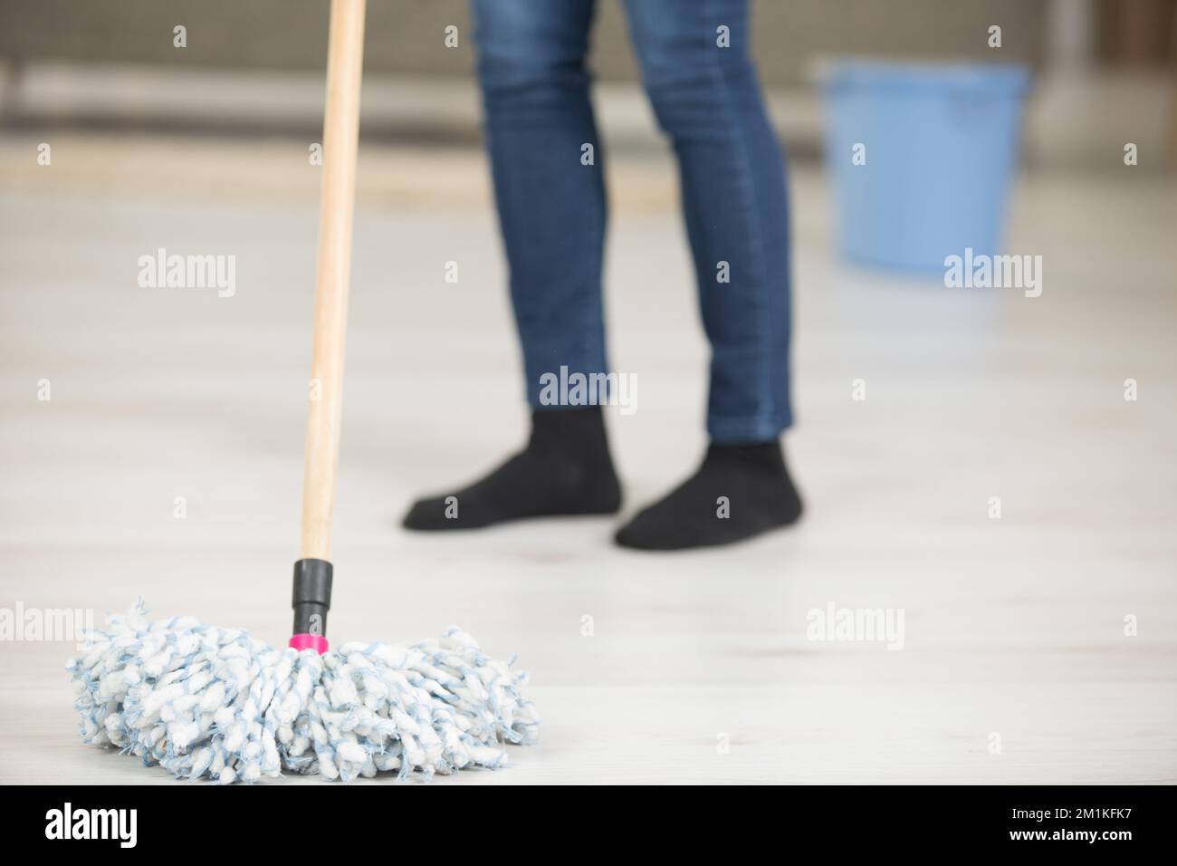 Woman mopping floor wearing hi-res stock photography and images - Alamy