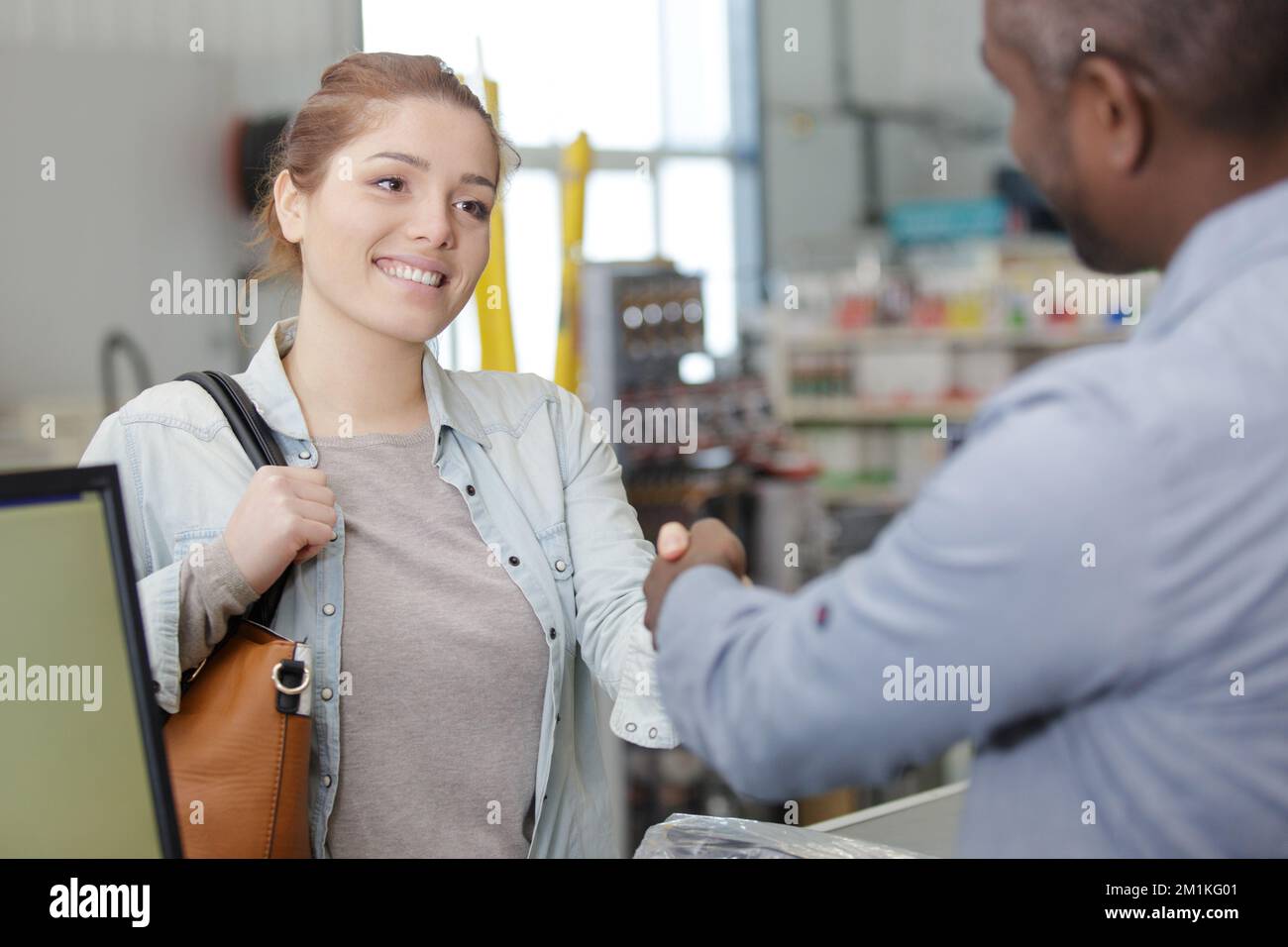 Woman handshake shopping hi-res stock photography and images - Alamy