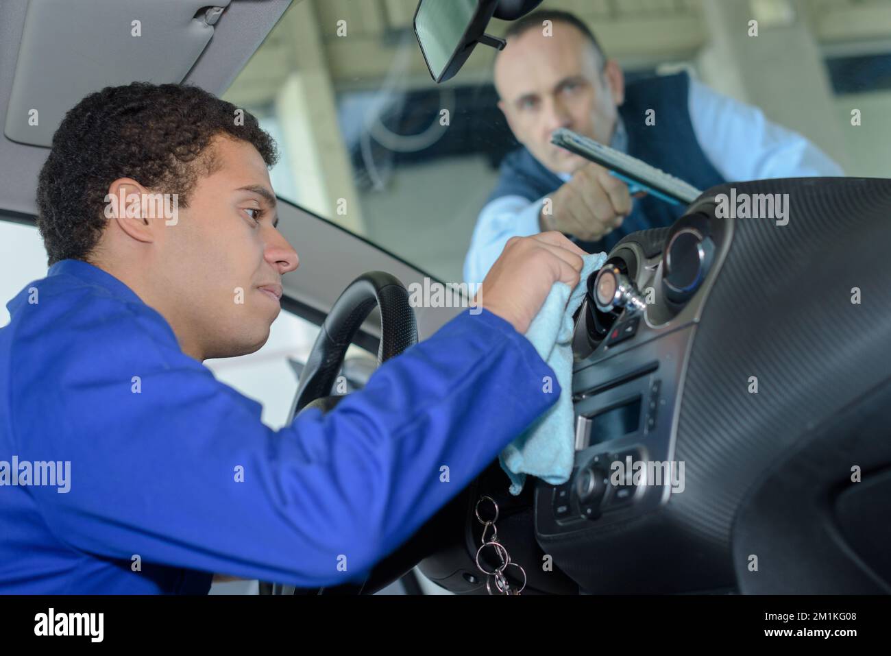 mechanic and technician cleaning the car Stock Photo - Alamy