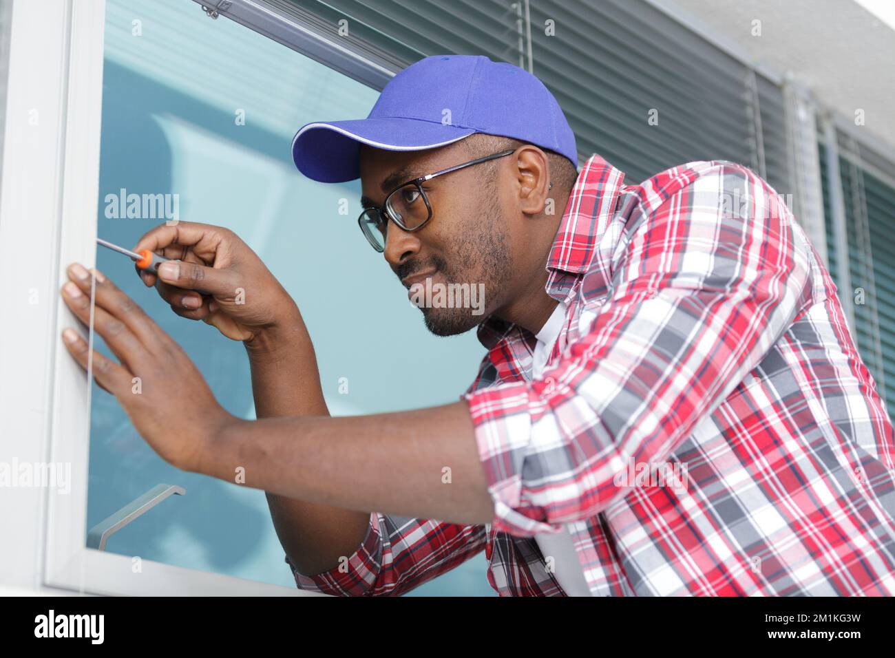 construction worker installing window in house Stock Photo - Alamy