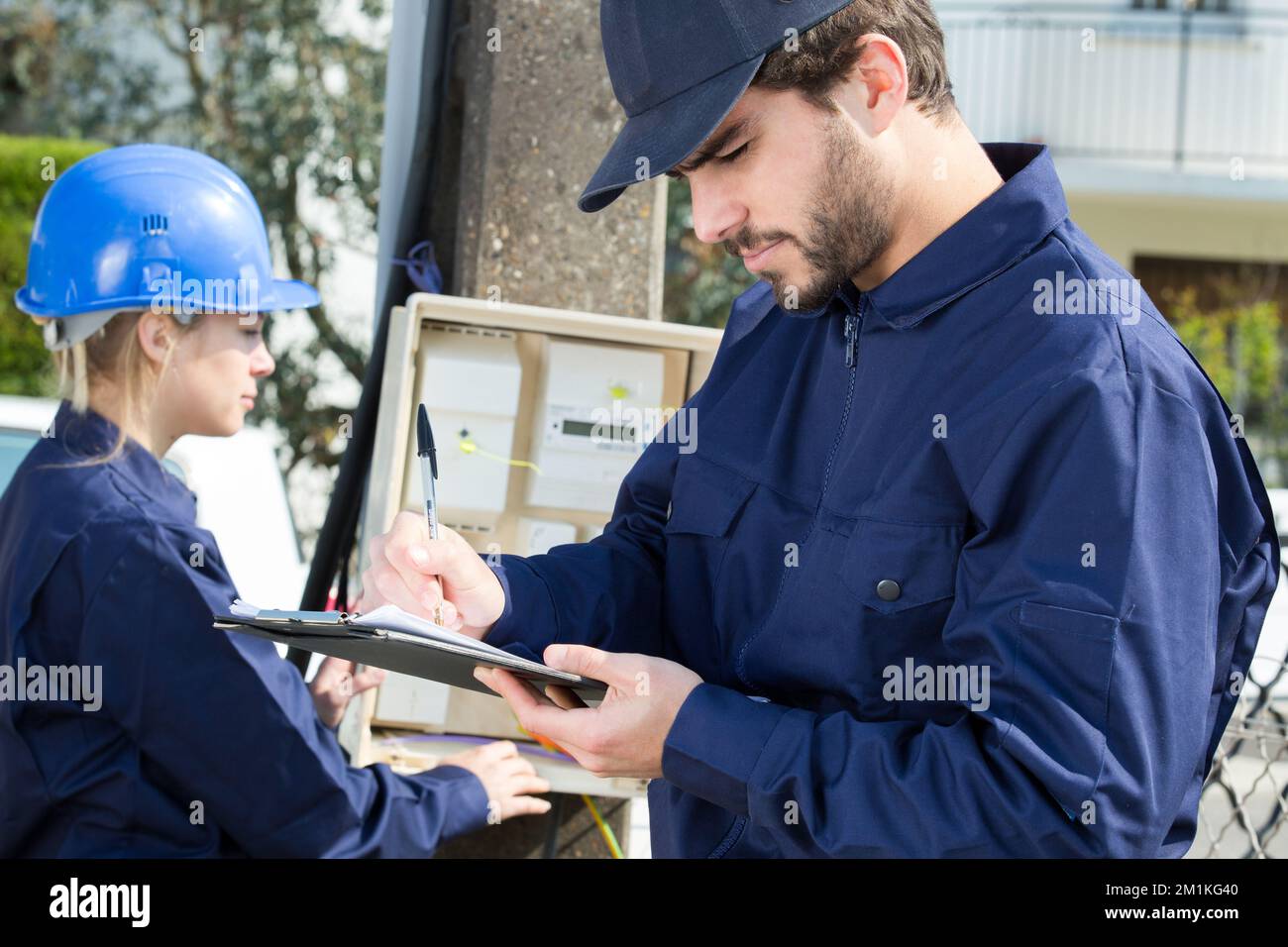 portrait of electrician using multimeter Stock Photo - Alamy
