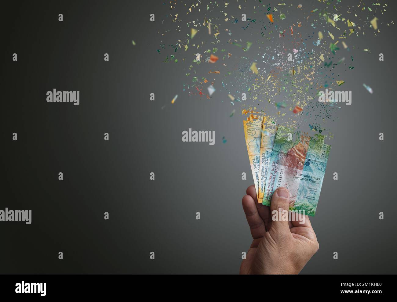 Inflation of swiss francs banknotes vanishing into nothing. Man hand ...