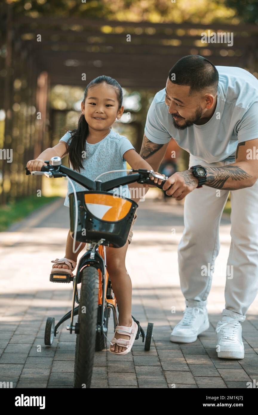 Dad Teaching Son To Ride Bike