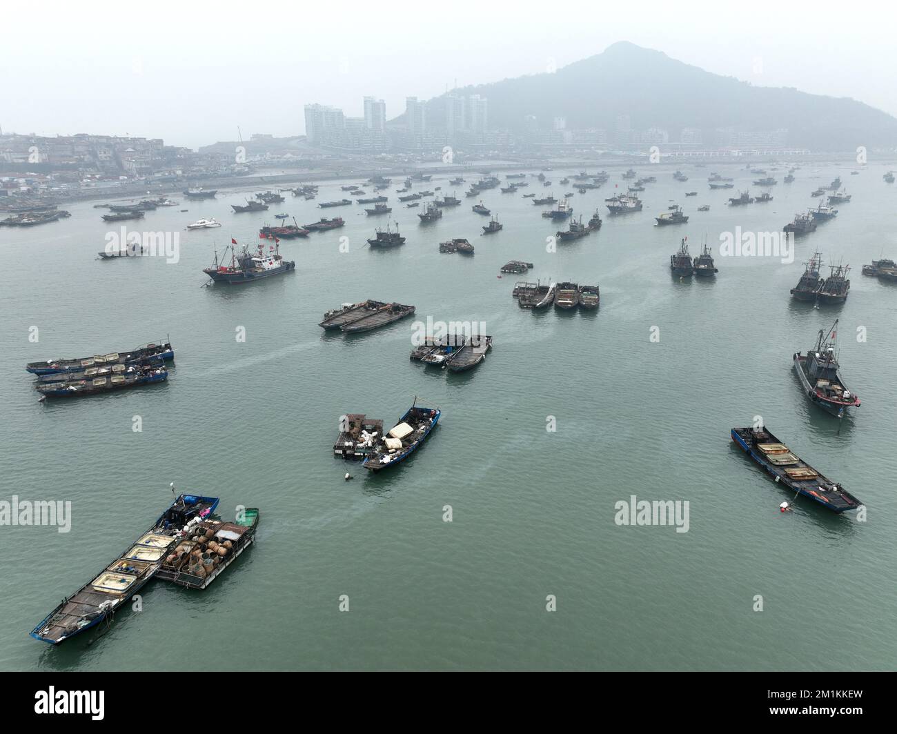 Aerial photo shows fishing boats returning to the harbor to avoid cold ...