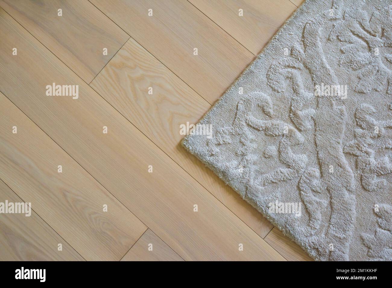 Laminate parquete floor, with soft carpet. interior design. Wooden ...