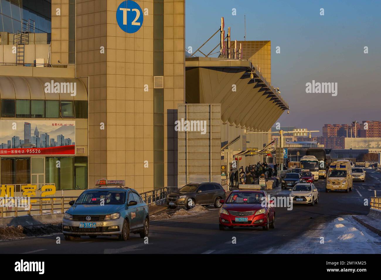 Cars passed by the T2 terminal of Urumqi Diwopu International Airport ...