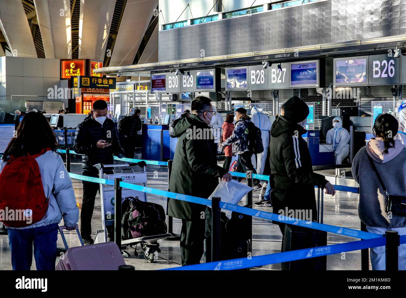 Passengers lined up to check in at Terminal T3 of Urumqi Diwopu ...