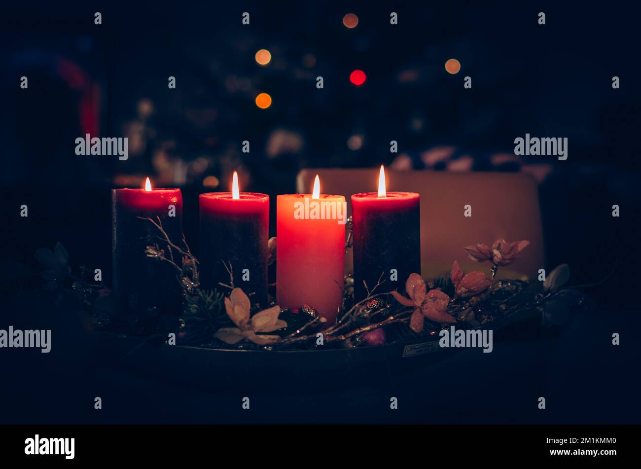 3 purple and 1 pink candles burning on advent wreath Stock Photo - Alamy