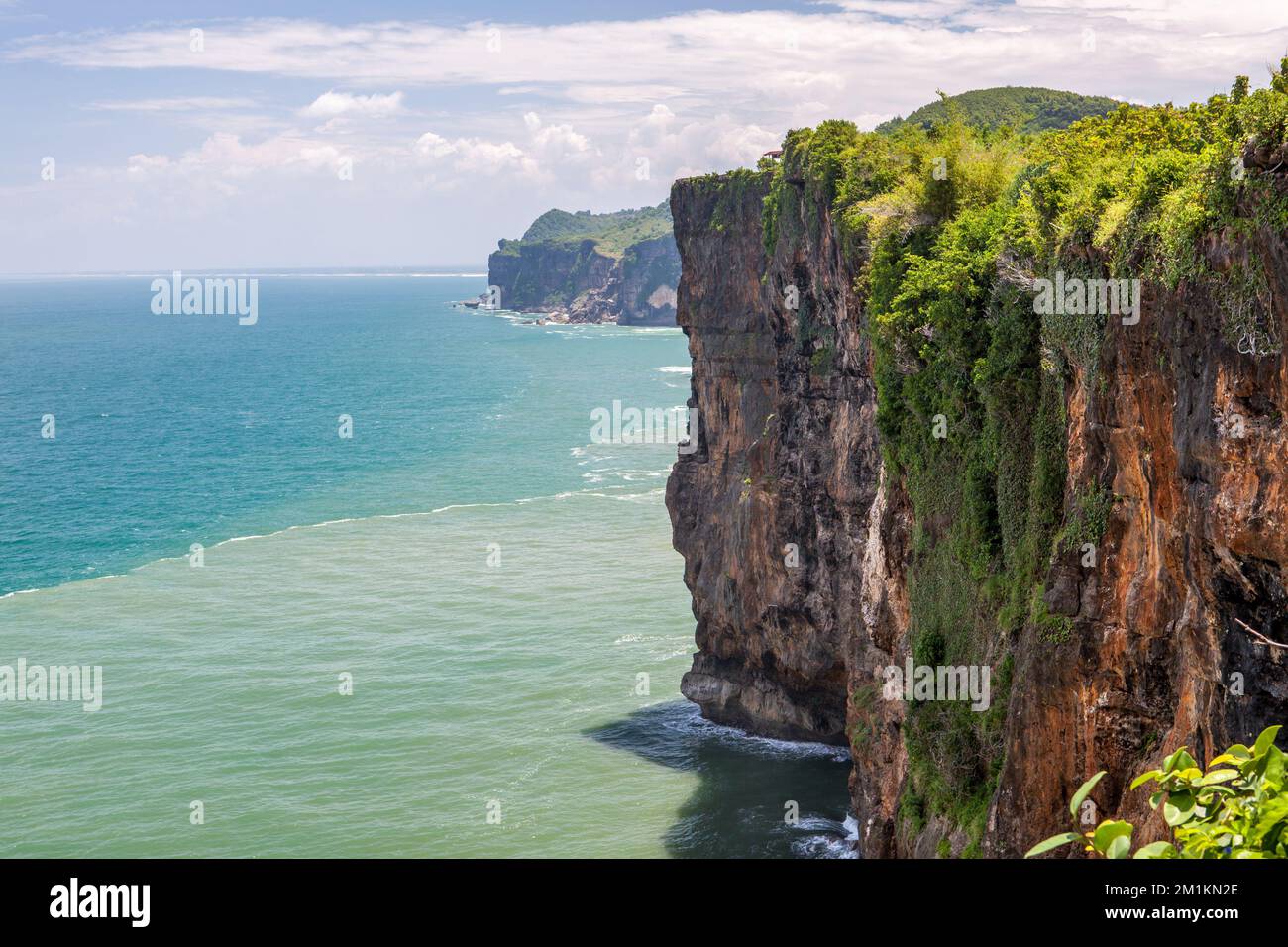 Tropical green rocks of Java island coast, Indonesia Stock Photo - Alamy